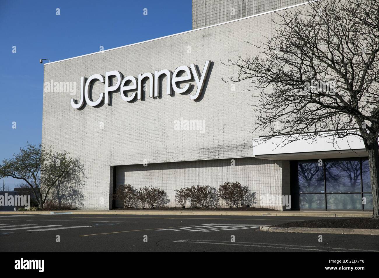 A logo sign outside of a JCPenney retail store location in North Wales ...