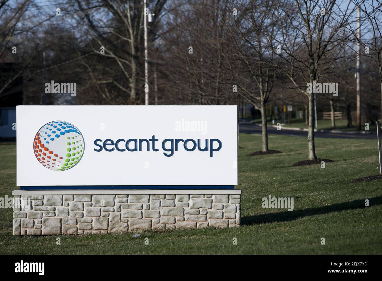 A logo sign outside of a facility occupied by the Secant Group in ...