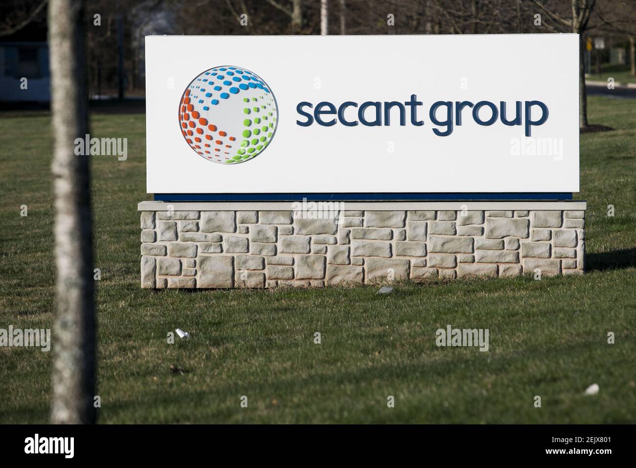 A logo sign outside of a facility occupied by the Secant Group in ...