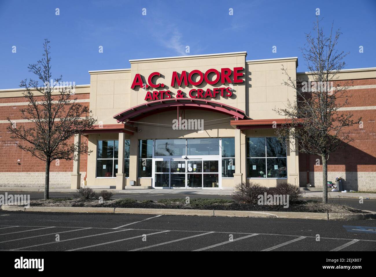 A logo sign outside of a A.C. Moore retail store location in North ...