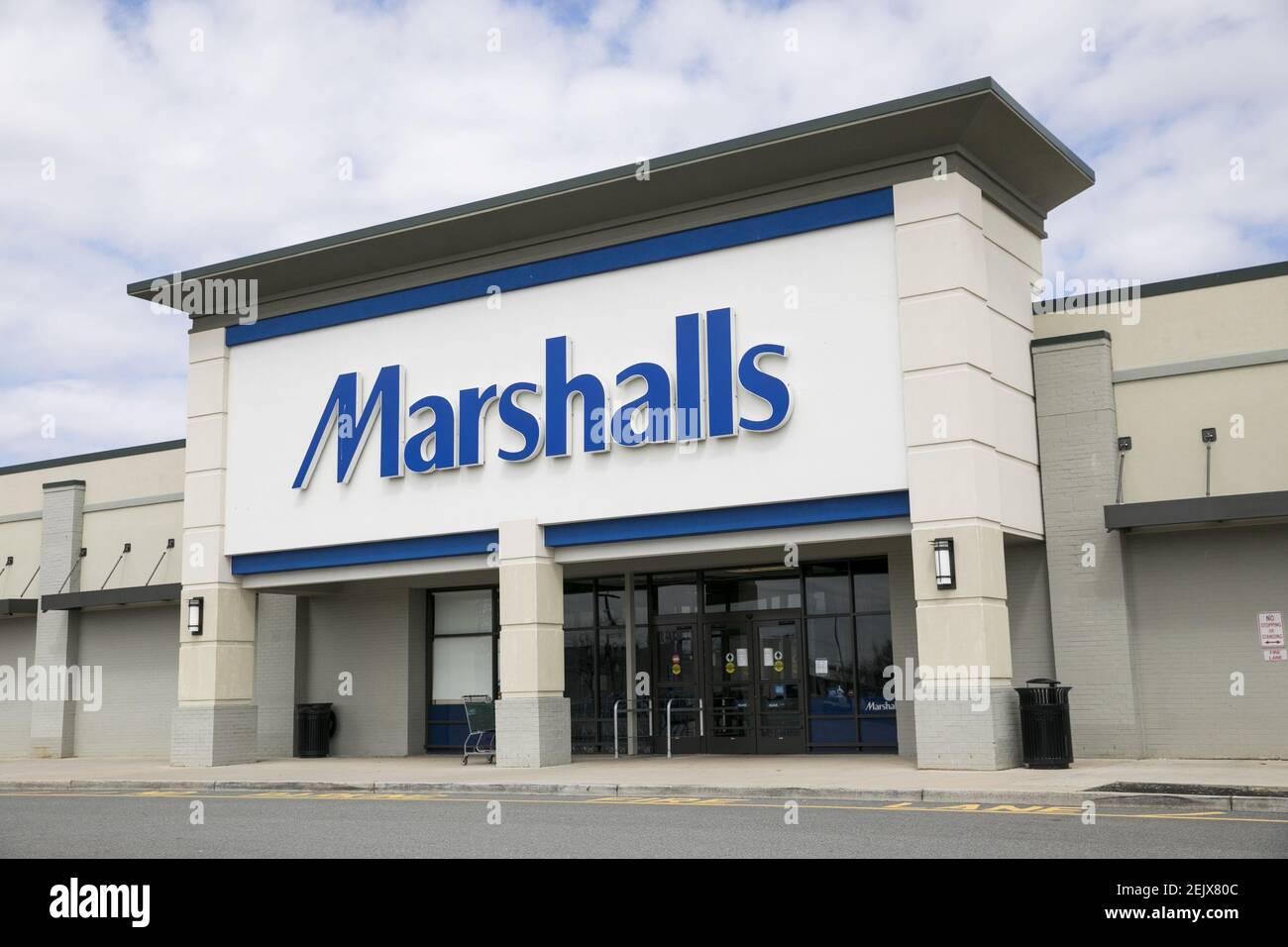 A logo sign outside of a Marshalls retail store location in East ...