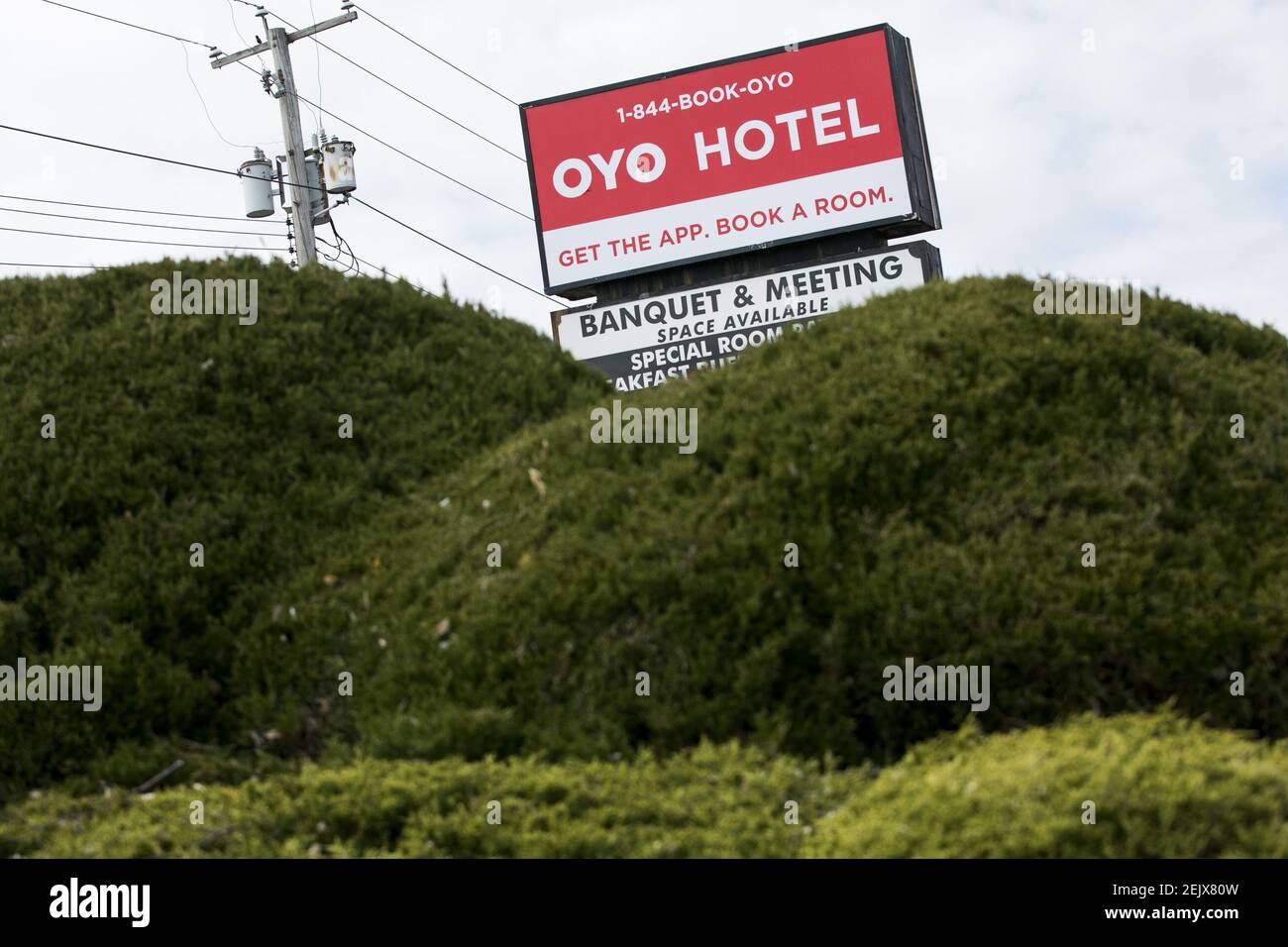 A logo sign outside of a Oyo Rooms Hotel in East Hanover, New Jersey ...