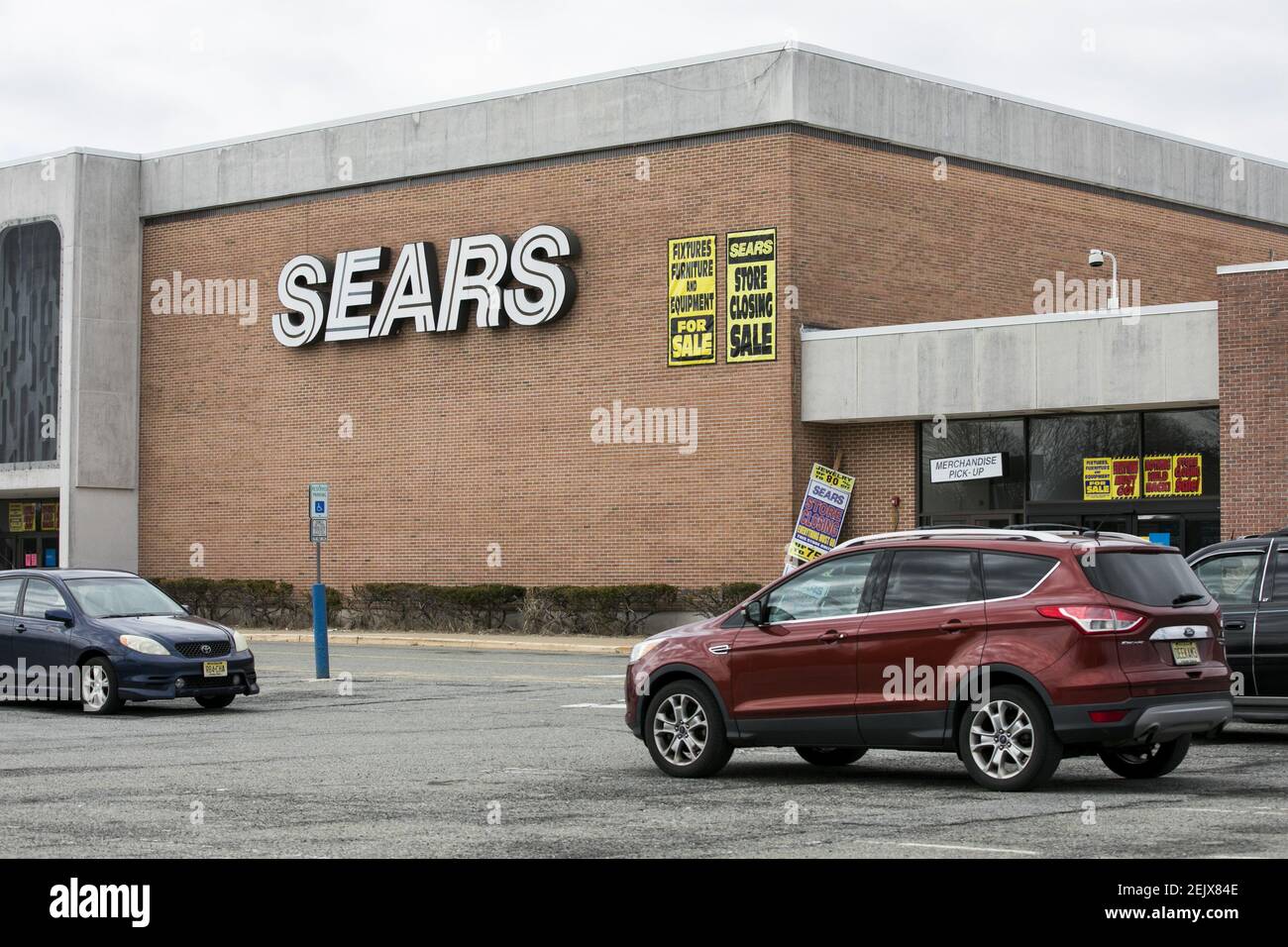 'Store Closing' signs outside of a Sears retail store location in ...