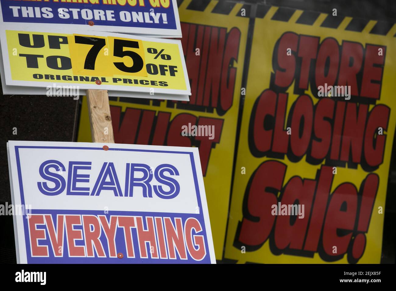 'Store Closing' signs outside of a Sears retail store location in ...