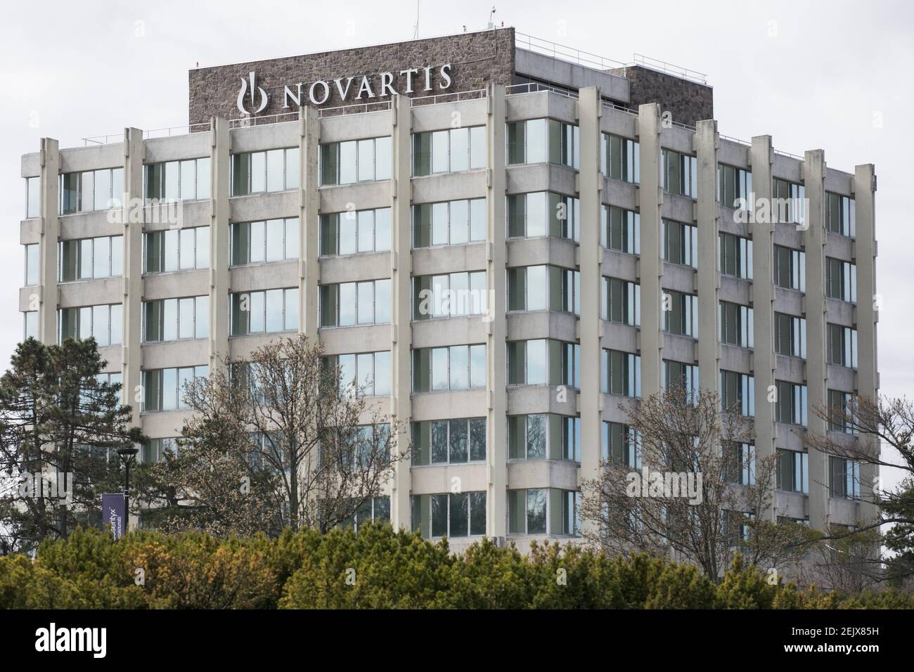 A logo sign outside of a facility occupied by Novartis in East Hanover ...