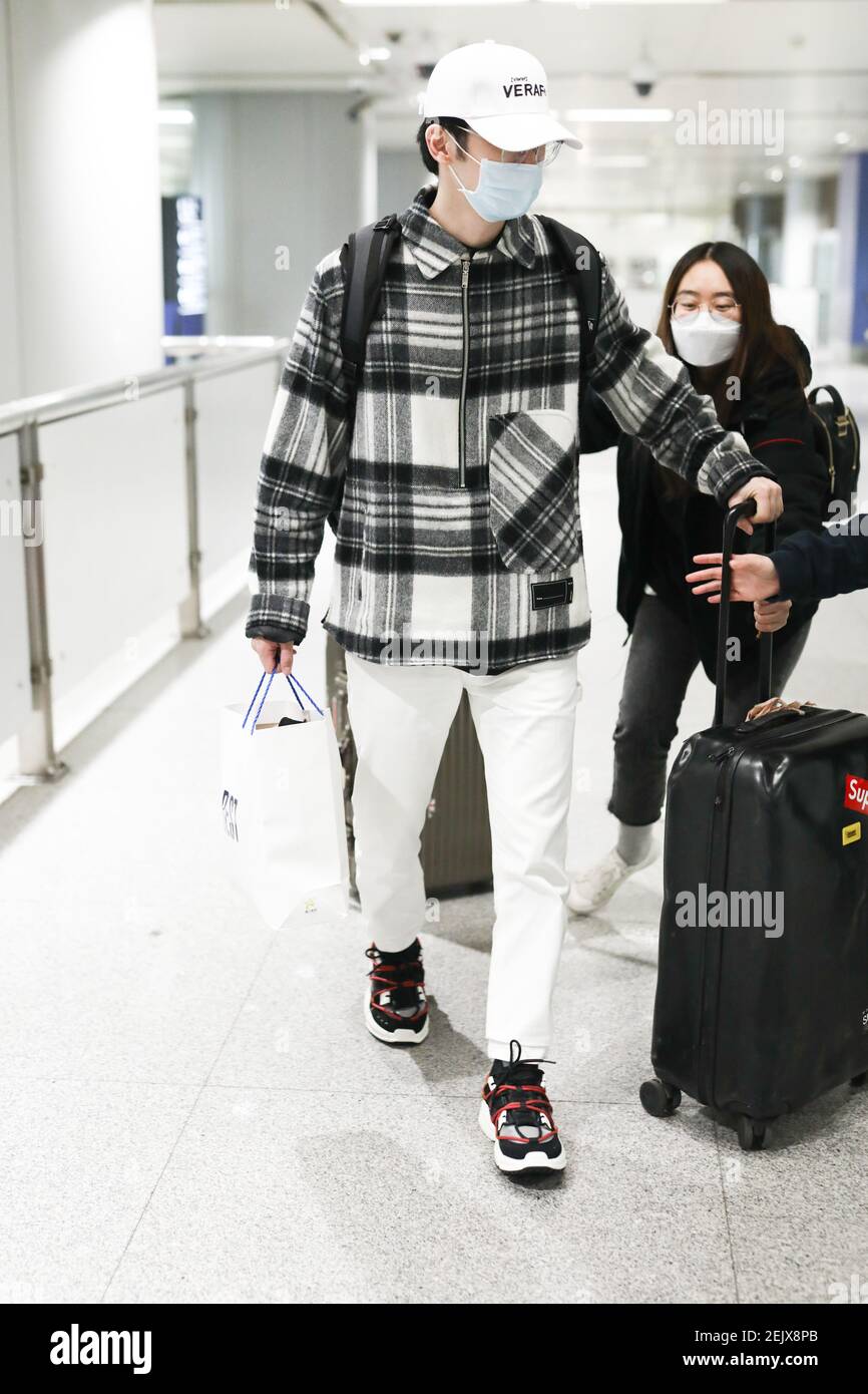 Chinese actor Liu Ruilin arrives at a Beijing airport before departure ...