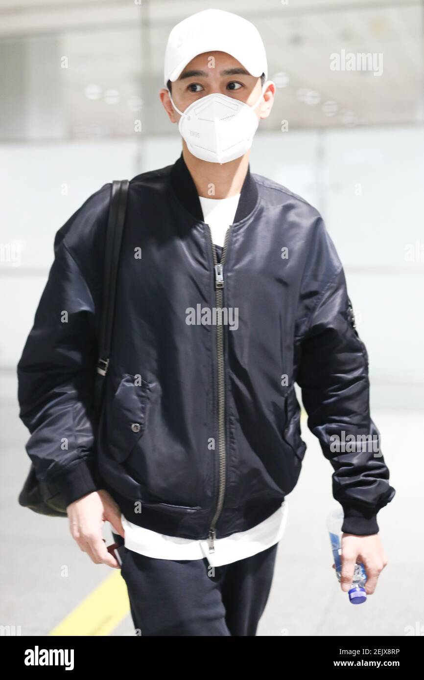 Chinese actor Qiao Zhenyu arrives at a Beijing airport after landing in ...