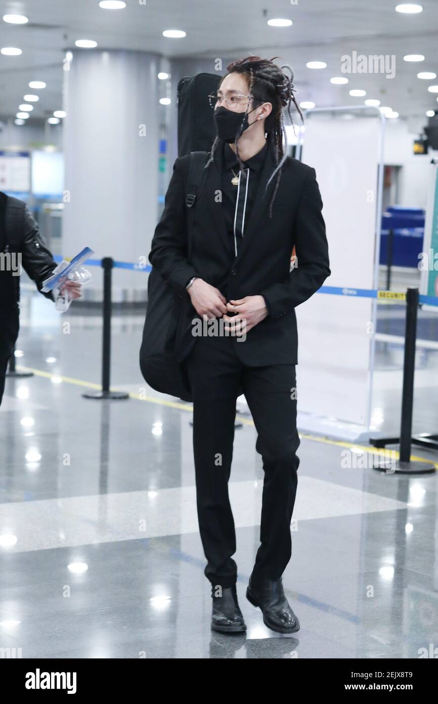 Chinese singer Yue Minghui arrives at a Beijing airport after landing ...