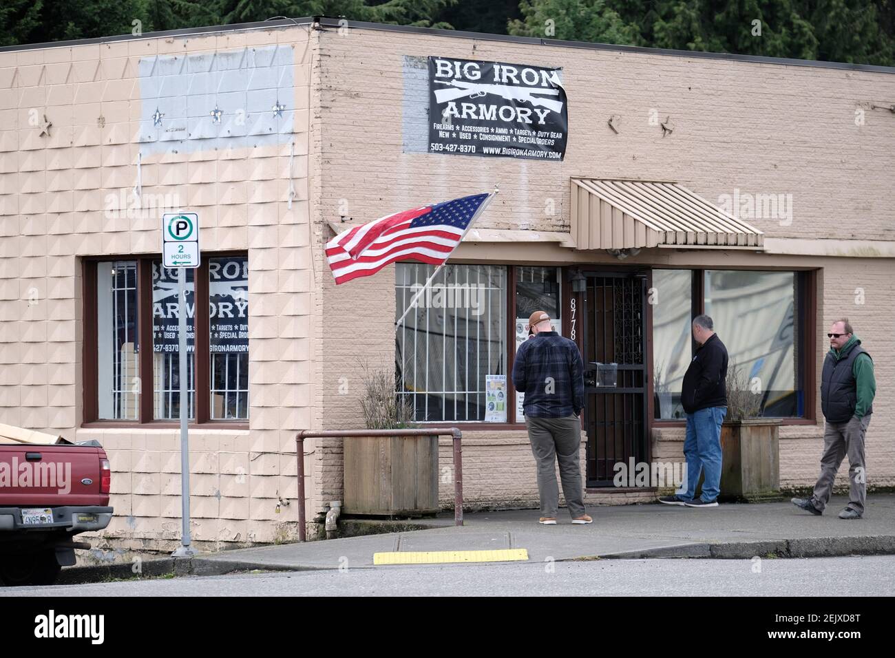 Men wait to enter the Big Iron Armory firearm and ammunition store in ...