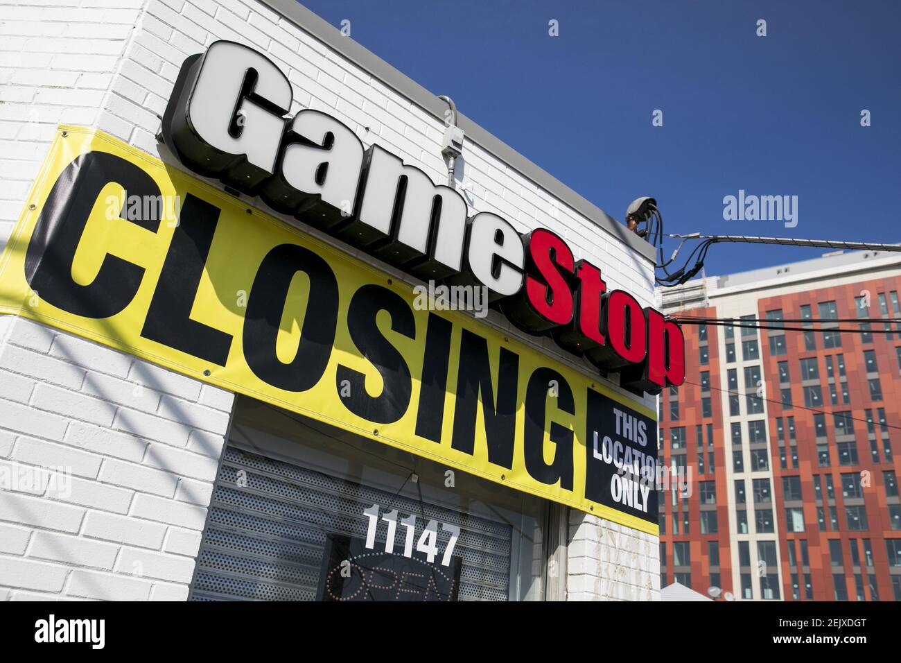 'Store Closing" signs outside of a GameStop retail store location in ...