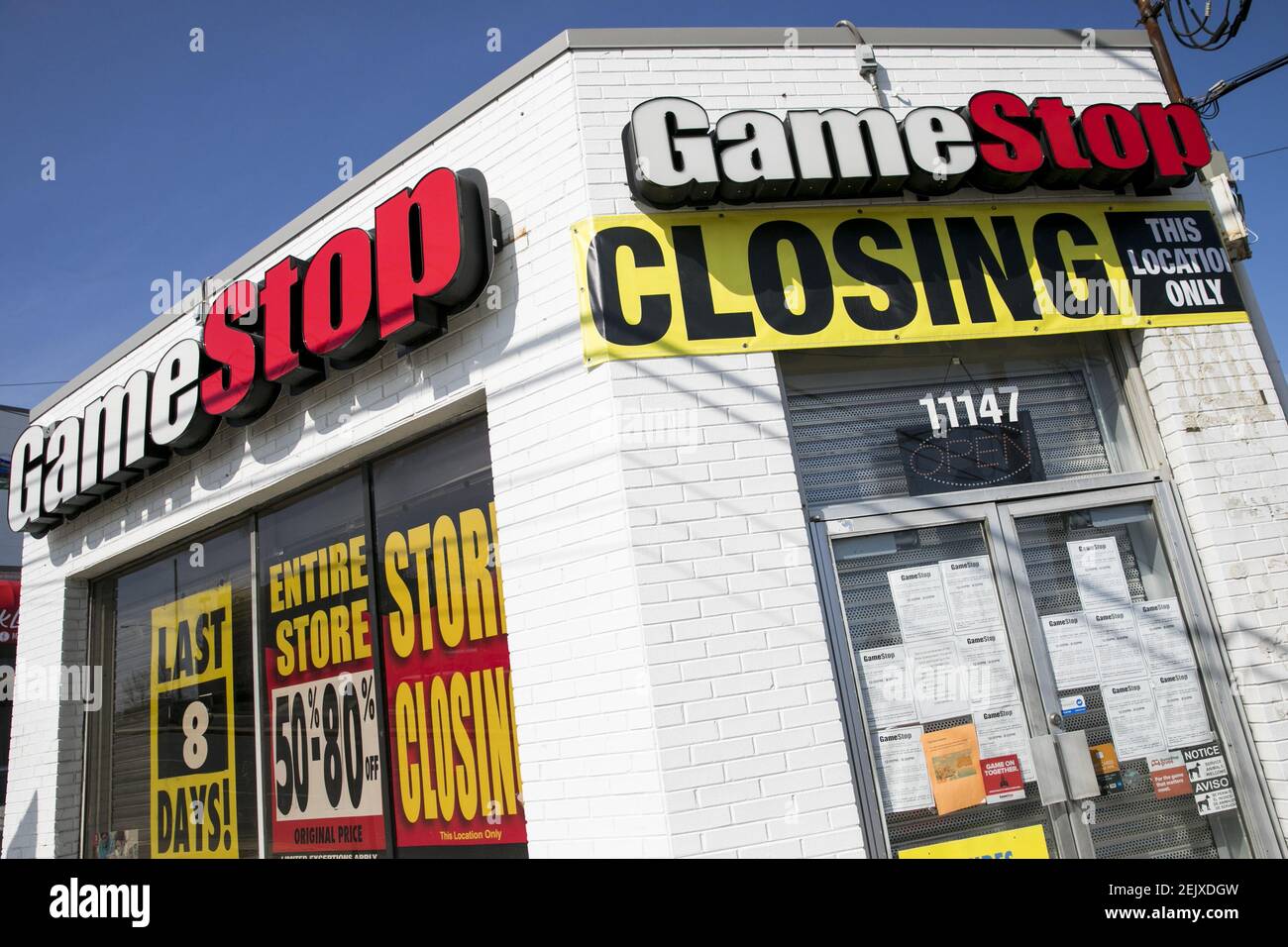 'Store Closing" signs outside of a GameStop retail store location in ...
