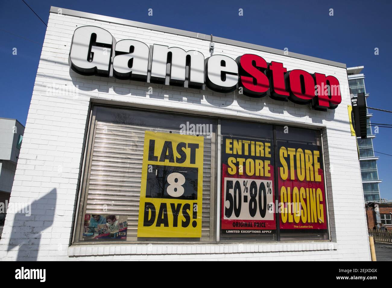 'Store Closing" signs outside of a GameStop retail store location in ...