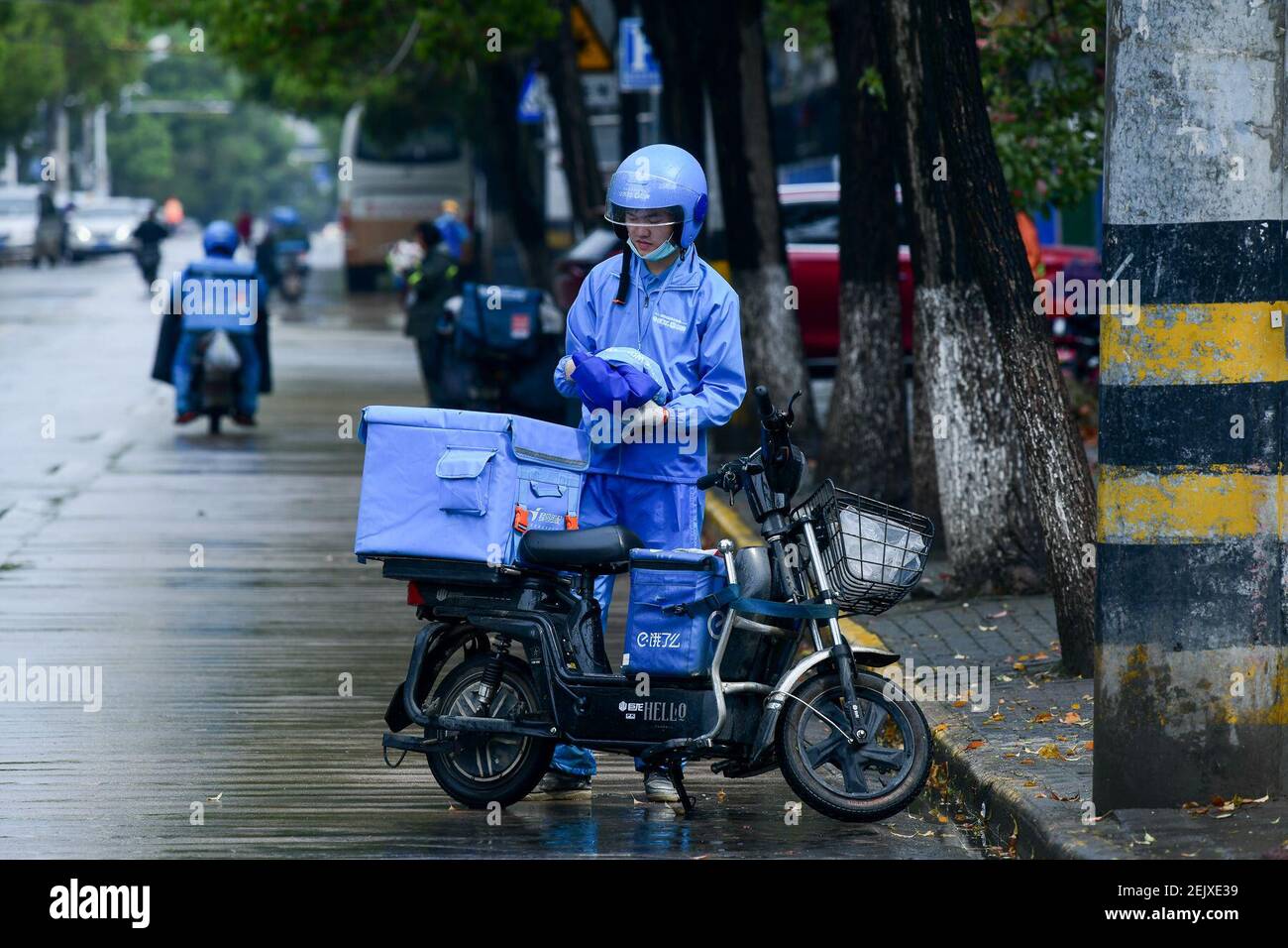 A delivery guy of Eleme.com prepares to deliver in Wuhan city, south ...