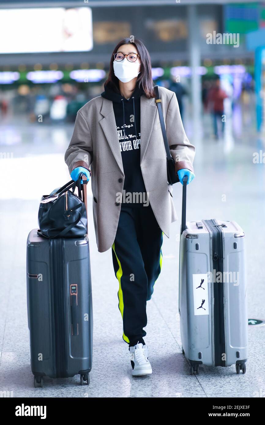 Chinese model Liu Wen arrives at a Beijing airport before departure in ...