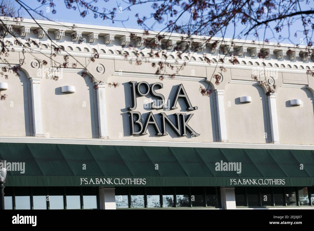 A logo sign outside of a JoS. A. Bank retail store location in Bel Air ...