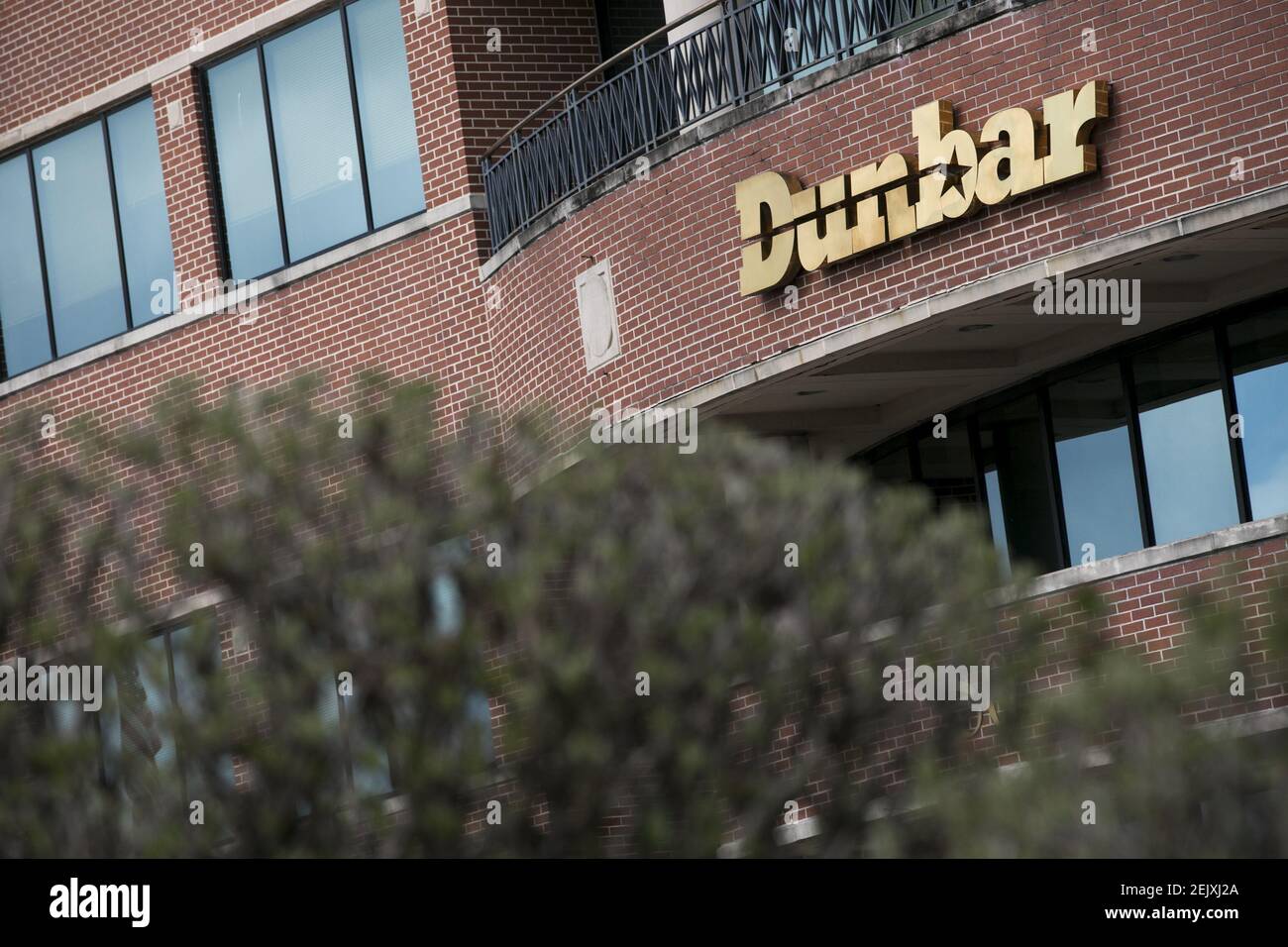 A logo sign outside of the headquarters of Dunbar Armored in Hunt ...