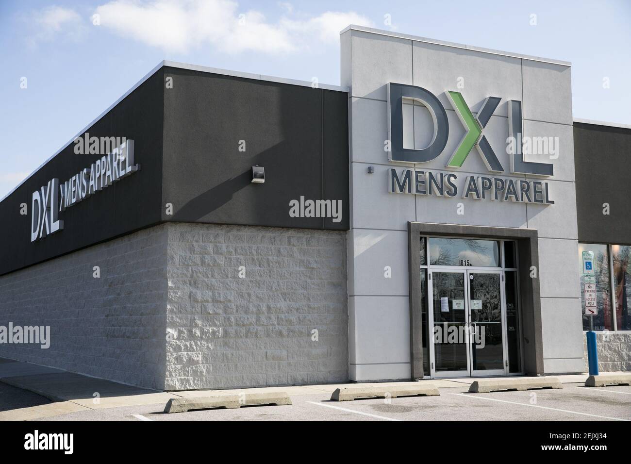 A logo sign outside of a Destination XL (DXL) retail store location in ...