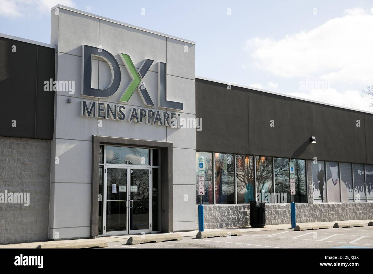 A logo sign outside of a Destination XL (DXL) retail store location in ...
