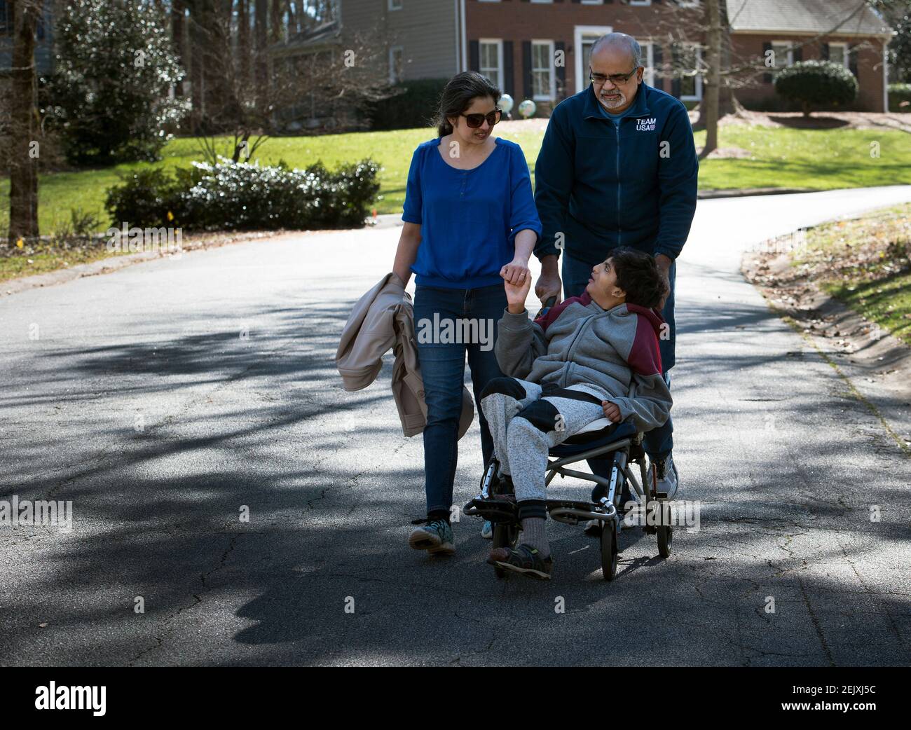 Marietta, GA, USA. 22nd Feb, 2021. Sitara and Ganesh Nayak take a daily ...