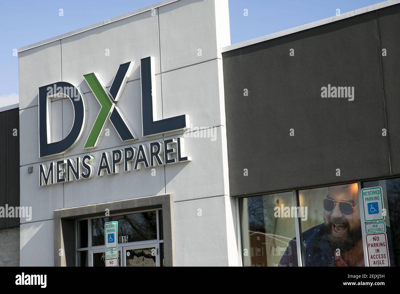A logo sign outside of a Destination XL (DXL) retail store location in ...