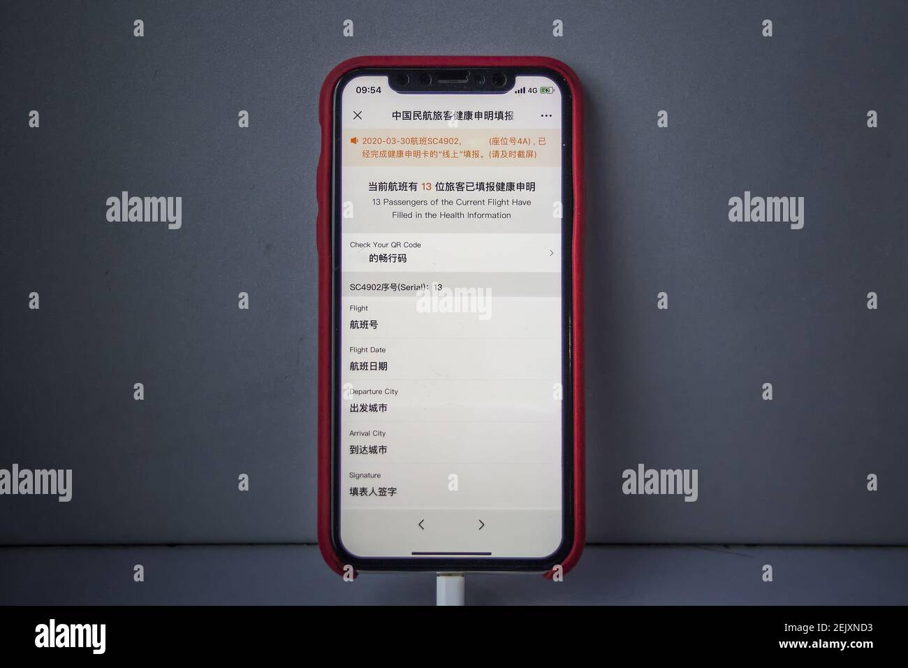 CHENGDU, CHINA - MARCH 30, 2020 - Passengers in line scan the code and ...