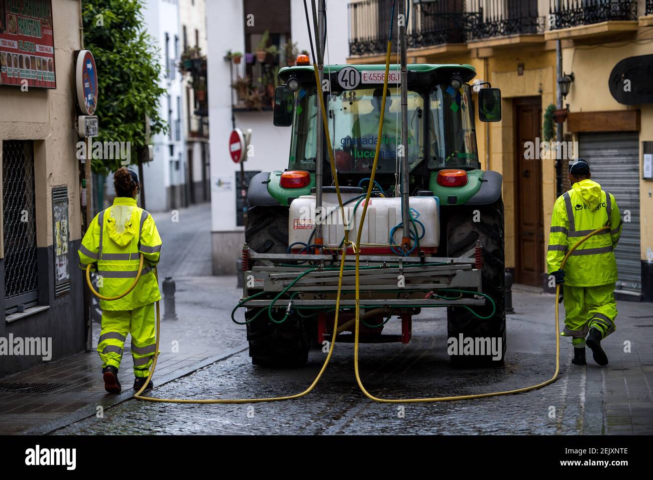 Members of the Granada cleaning team disinfect the streets with the ...