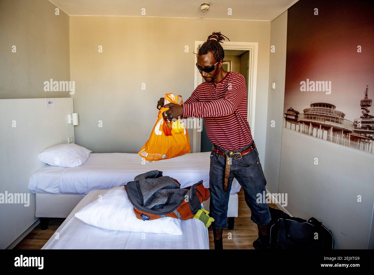 A homeless man in one of Andante hotel rooms. The Dutch Salvation Army ...