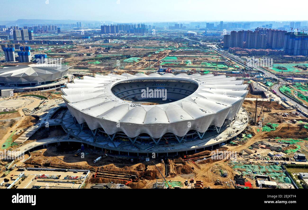 An aerial view of structures under construction, which restarts recently, in Xi'an city ...