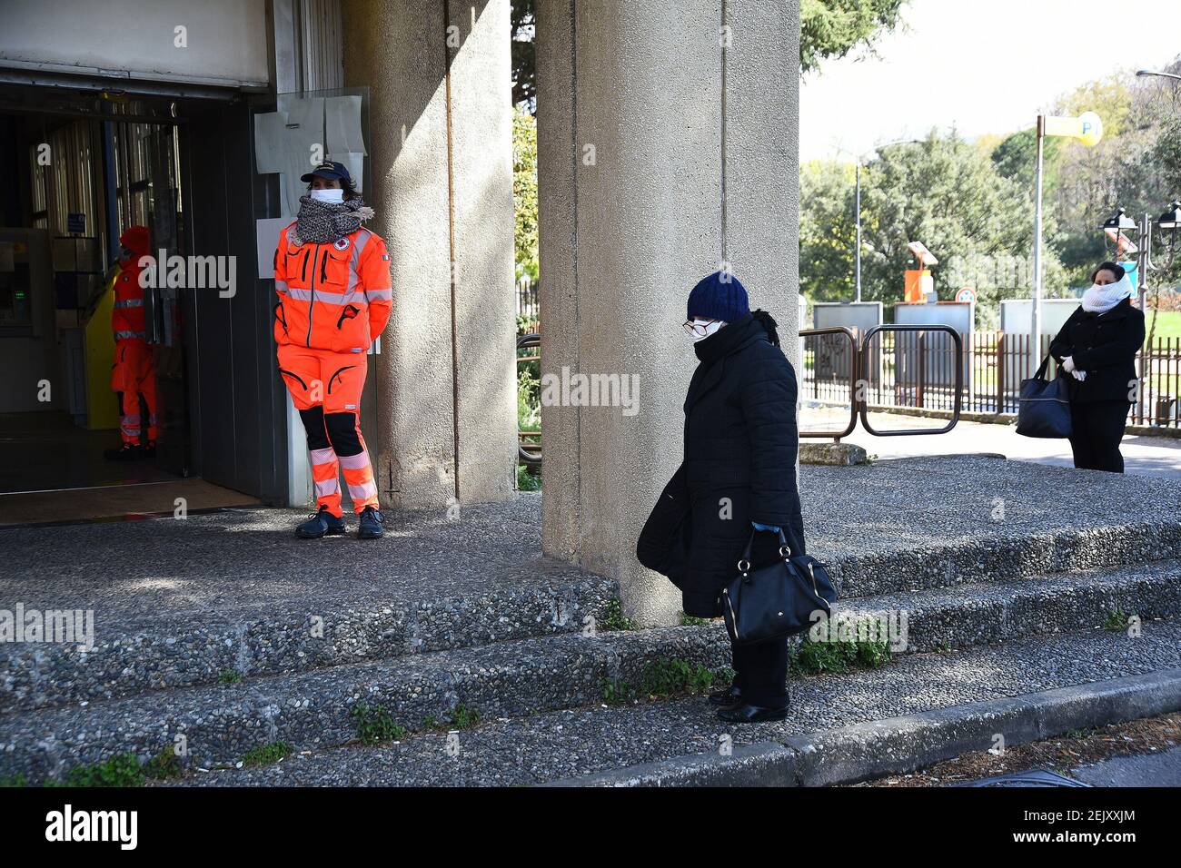 People keep a safe distance as part of precautionary measures against ...
