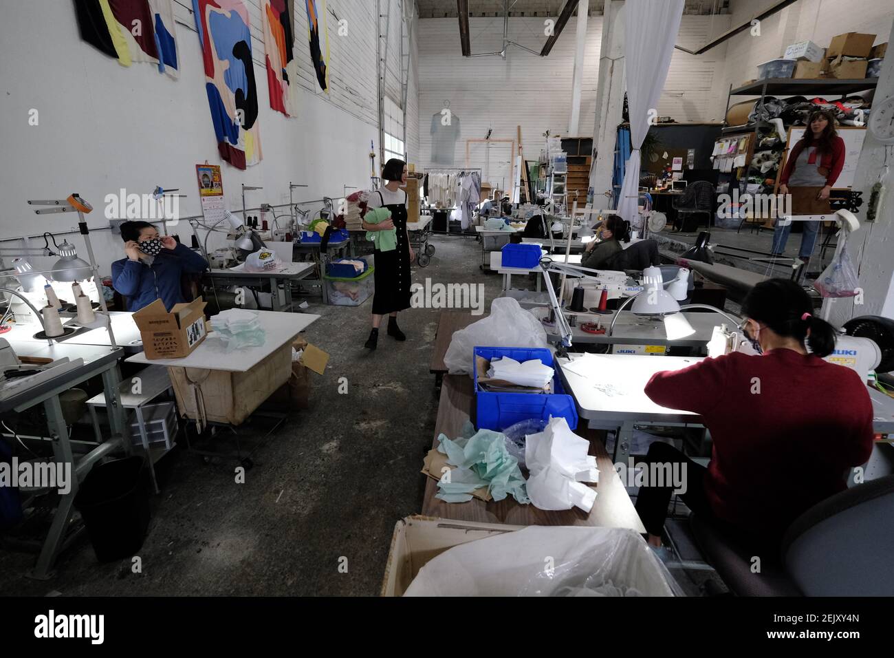 Workers make face masks at the Portland Garment Factory in Portland ...