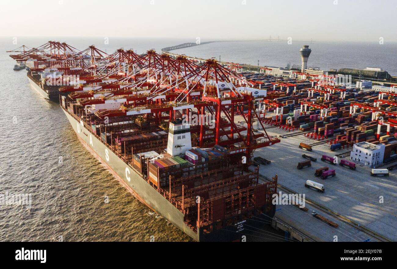 An aerial view of containers piled up at Yangshan Port, a deep water port for container ships ...