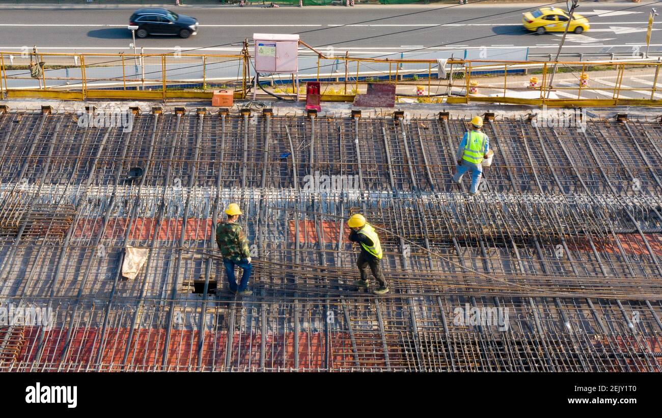 An aerial view of workers busy at the construction site to build the to ...