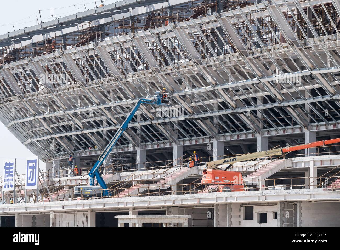 Workers are busy at constructing the Pudong Football Stadium, which ...