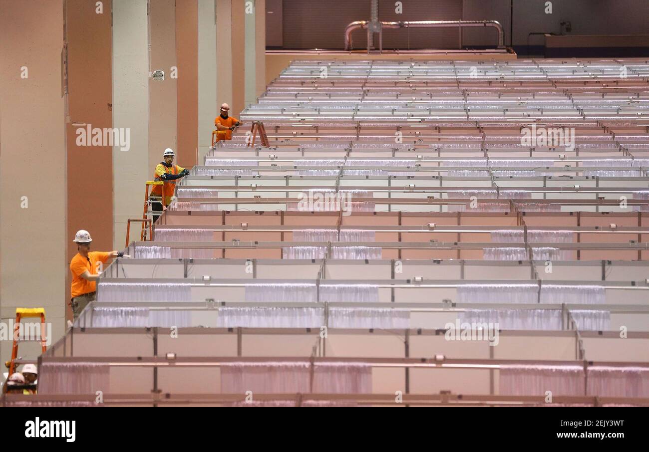 Construction workers put the finishing touches on Hall C Unit 1 of the ...