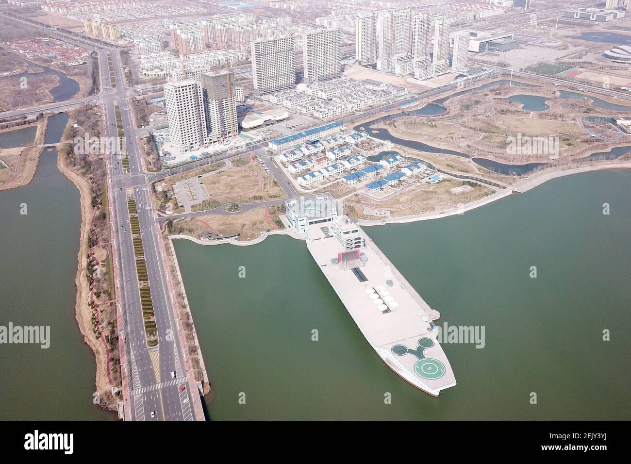 Aerial view of a ship-looking office building under contsruction over ...