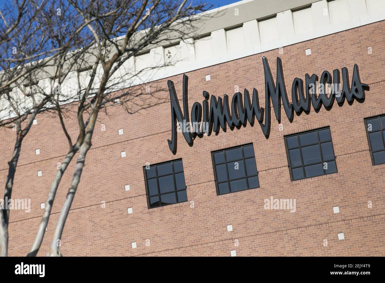 A logo sign outside of a Neiman Marcus retail store location in Tysons ...