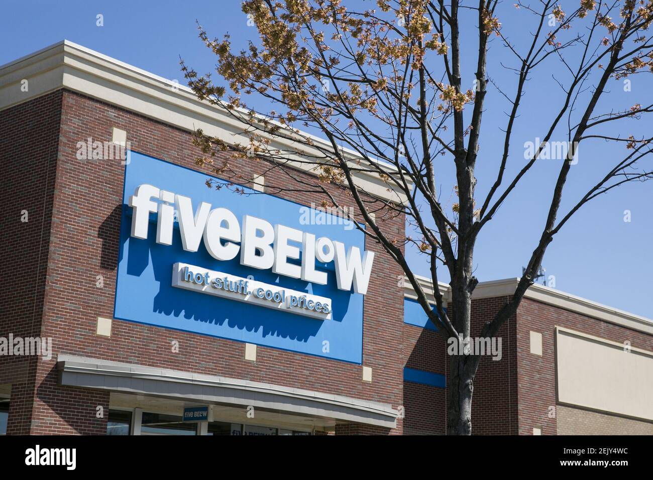 A logo sign outside of a Five Below retail store location in ...