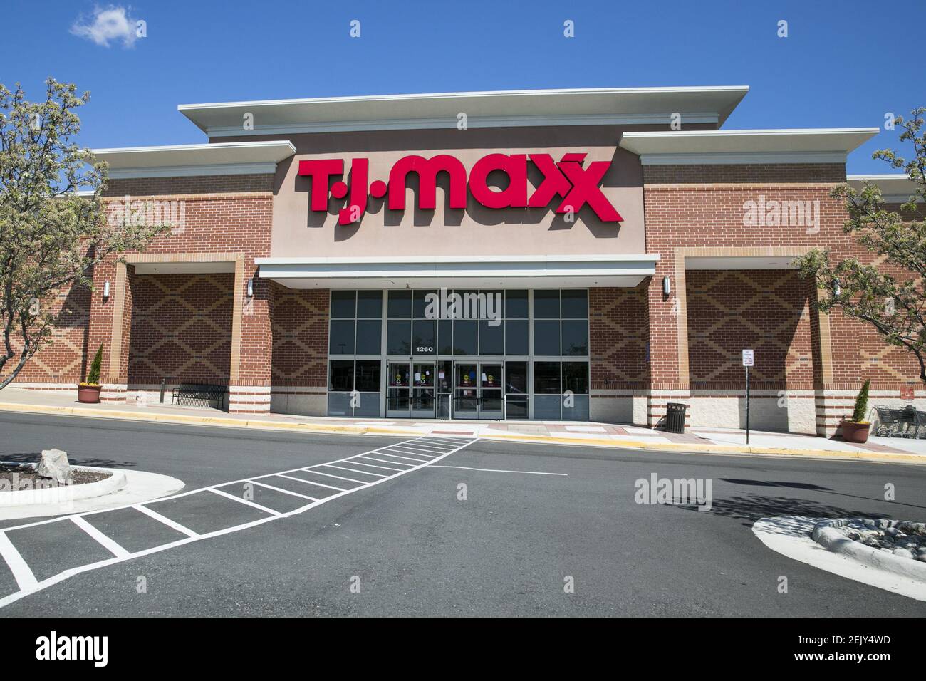 A logo sign outside of a TJ Maxx retail store location in Stafford ...