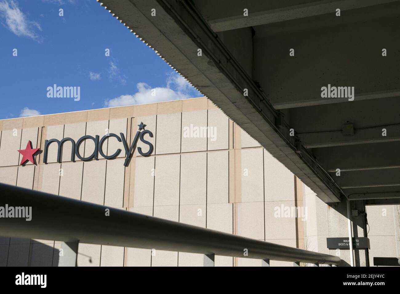 A logo sign outside of a Macy's retail store location in Springfield ...