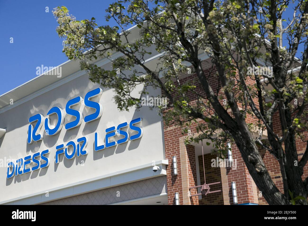 A logo sign outside of a Ross Stores retail store location in Stafford ...