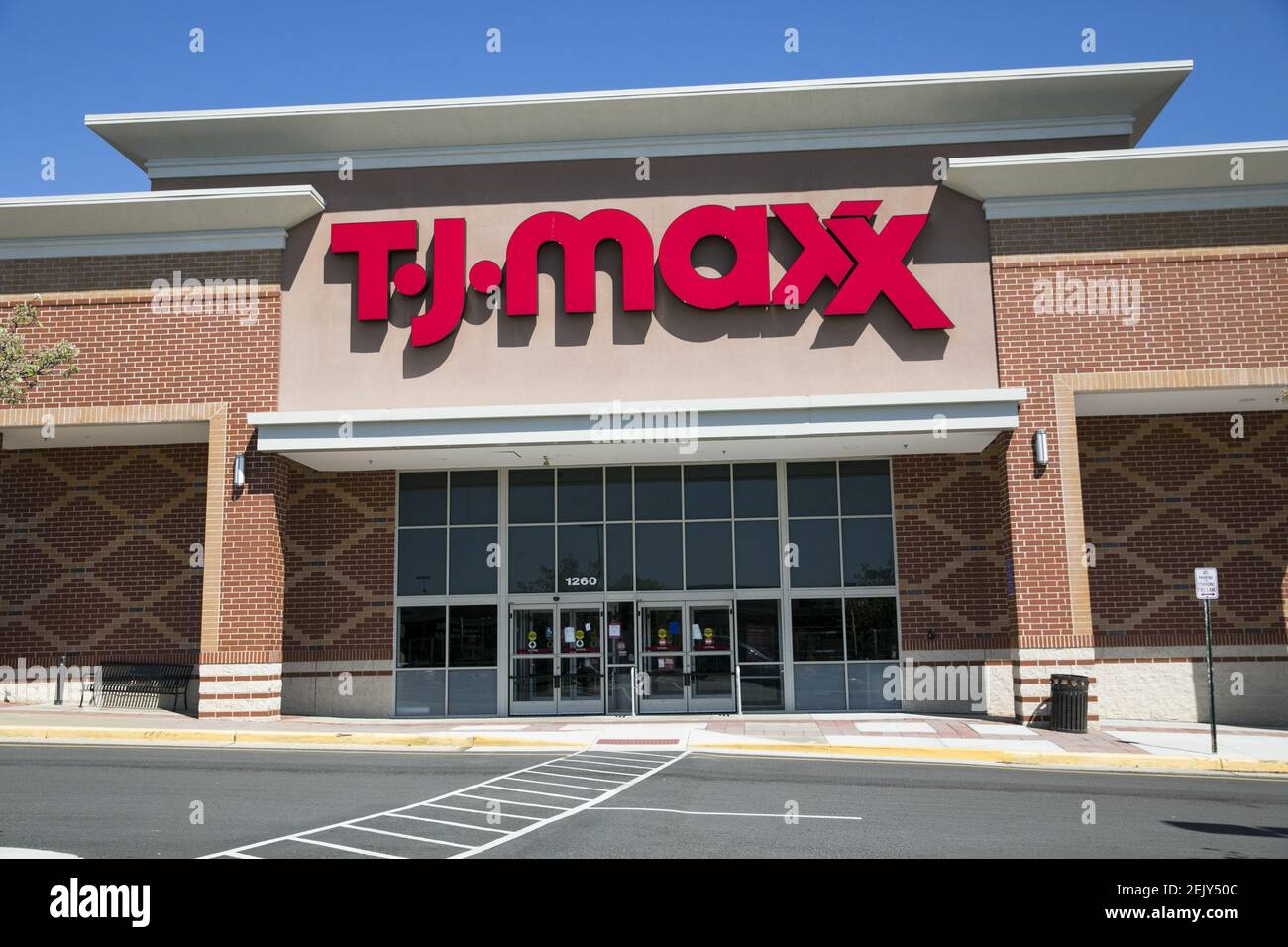 A logo sign outside of a TJ Maxx retail store location in Stafford ...