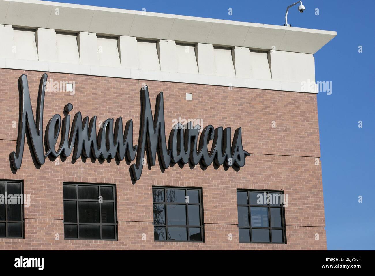 A logo sign outside of a Neiman Marcus retail store location in Tysons ...