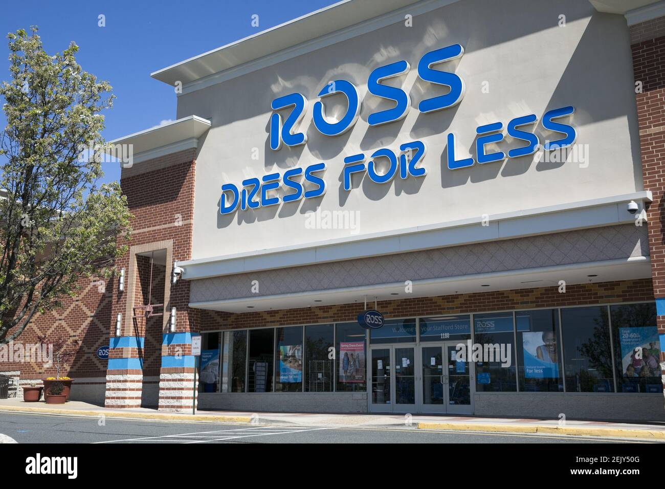 A logo sign outside of a Ross Stores retail store location in Stafford ...
