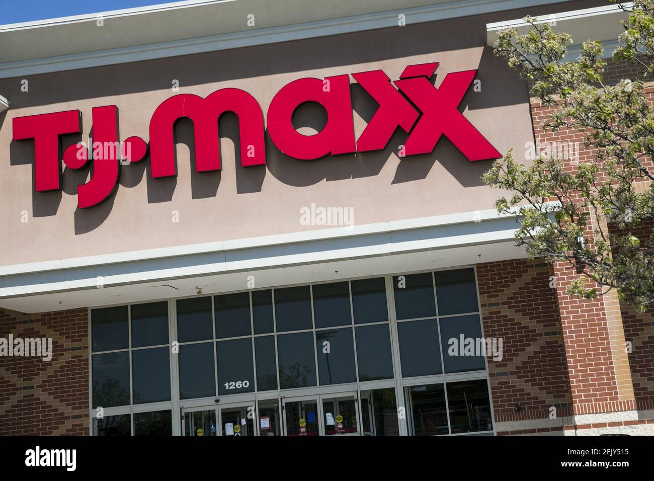 A logo sign outside of a TJ Maxx retail store location in Stafford ...