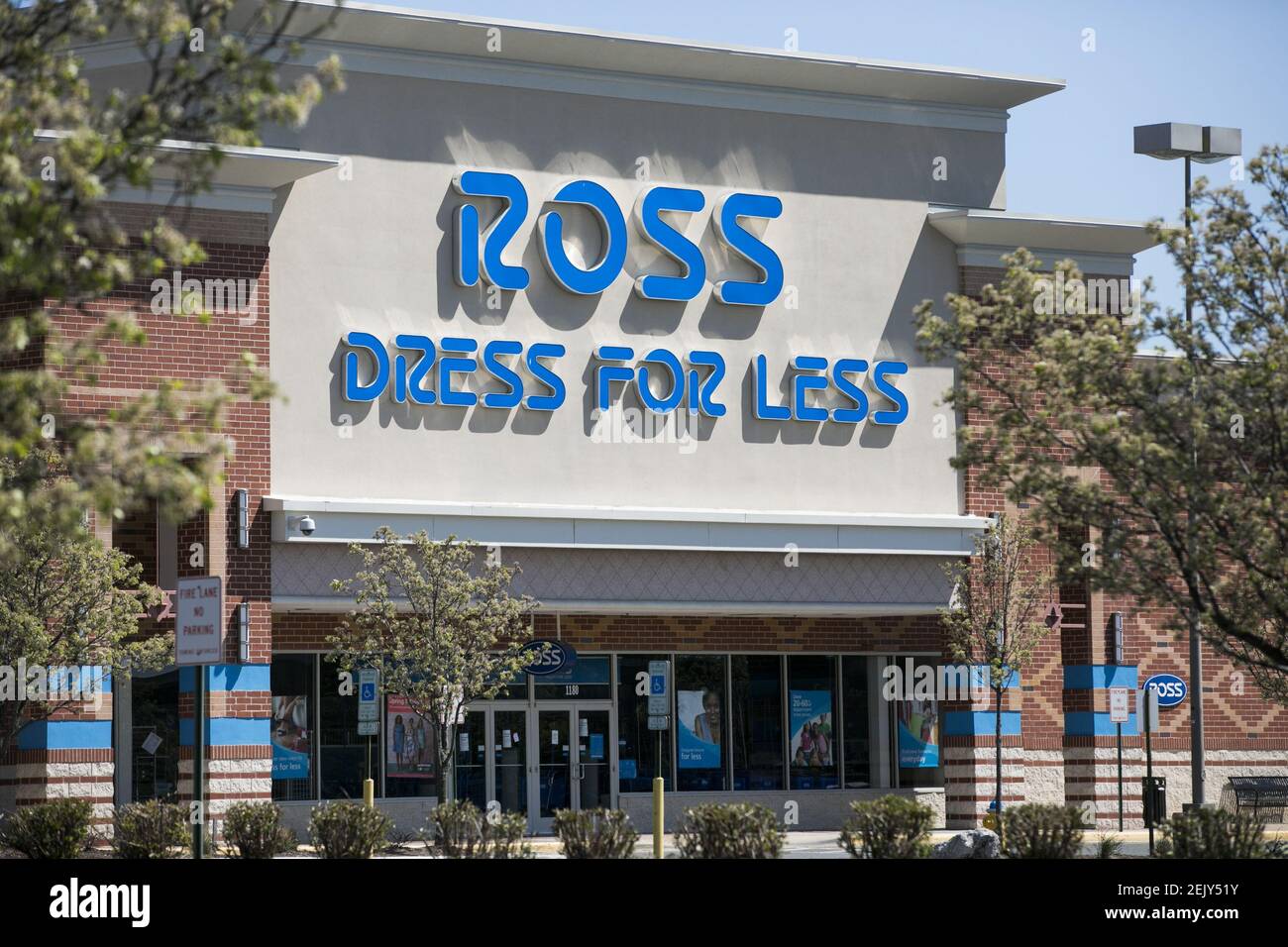 A logo sign outside of a Ross Stores retail store location in Stafford ...