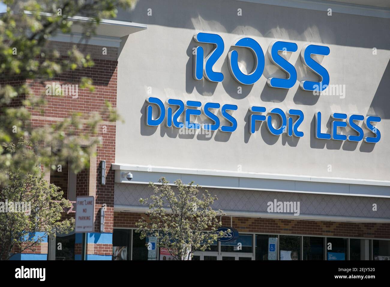 A logo sign outside of a Ross Stores retail store location in Stafford ...