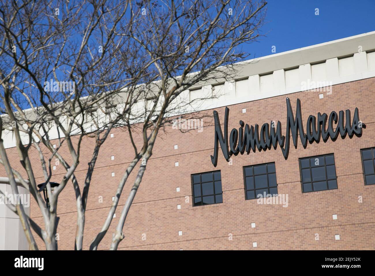 A logo sign outside of a Neiman Marcus retail store location in Tysons ...