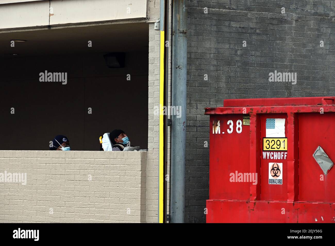 A patient is seen being wheeled up the emergency entrance ramp at the ...
