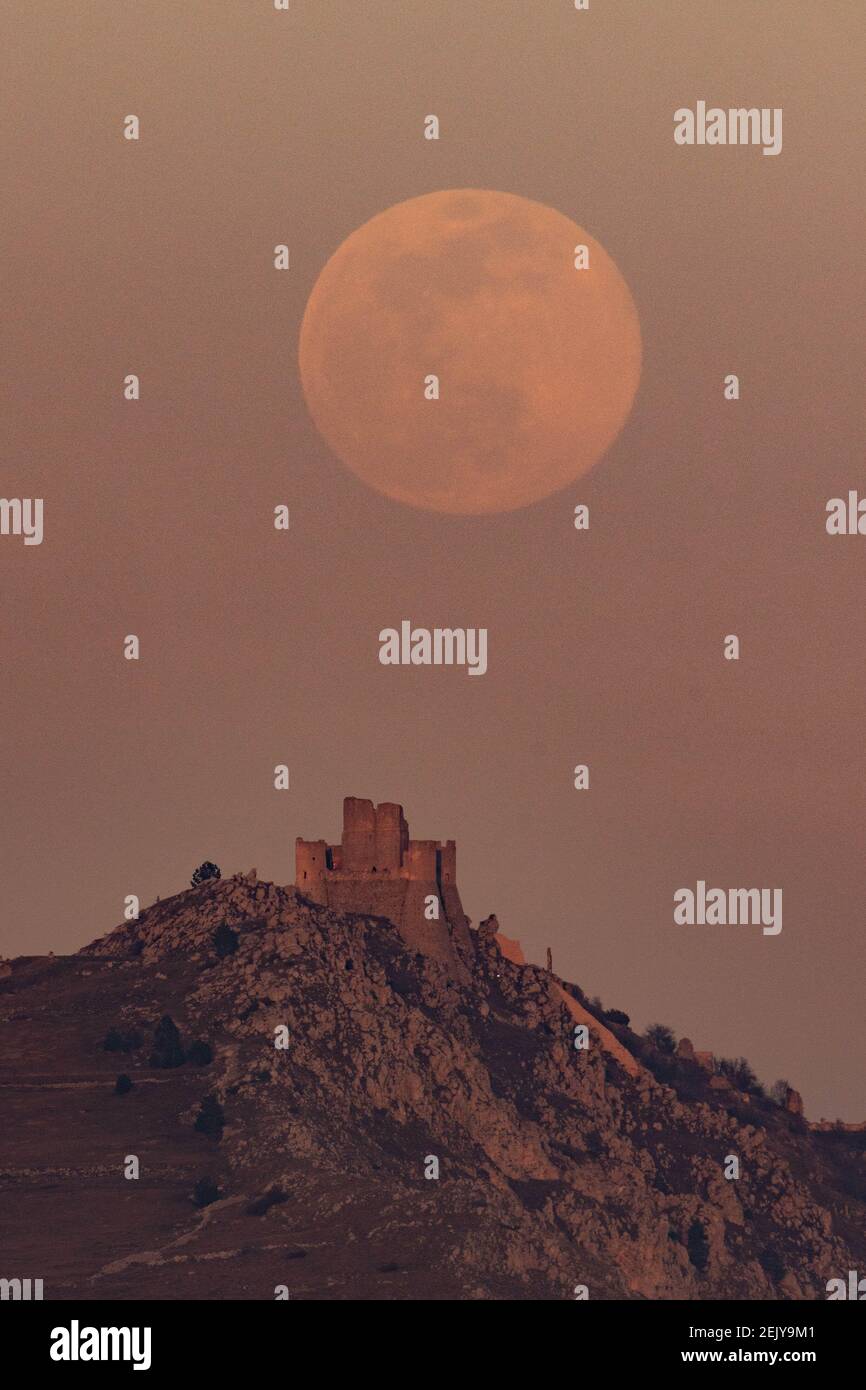The Super Moon (Pink Moon) rising behind Rocca Calascio Castle in ...