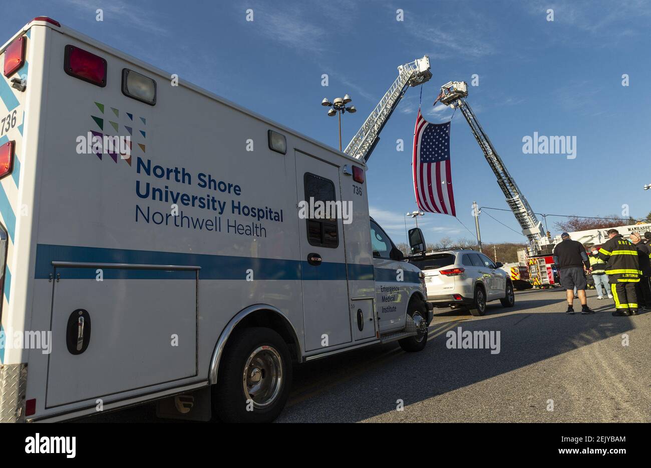 Ambulance stands during Nassau County first responders line up to ...